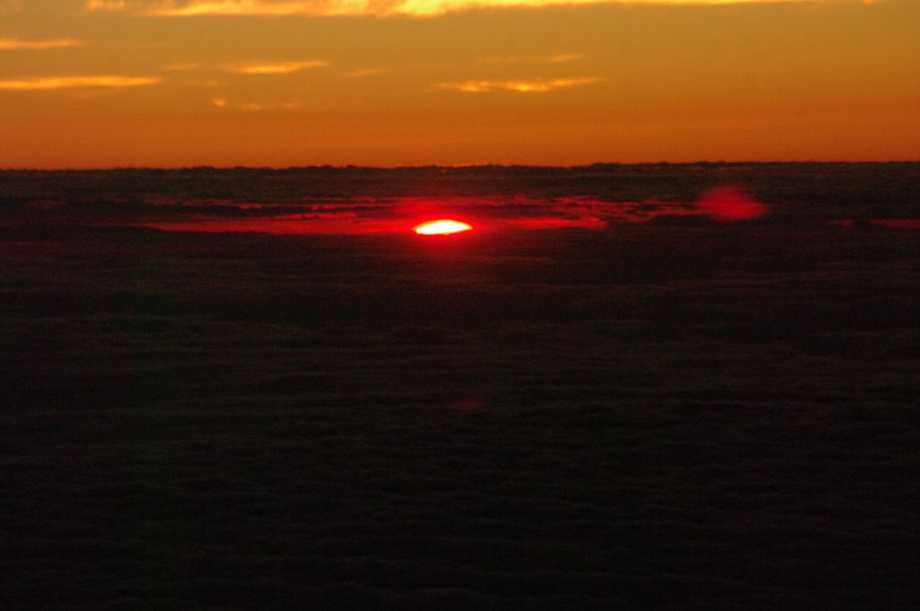 Sun disappearing into the clouds